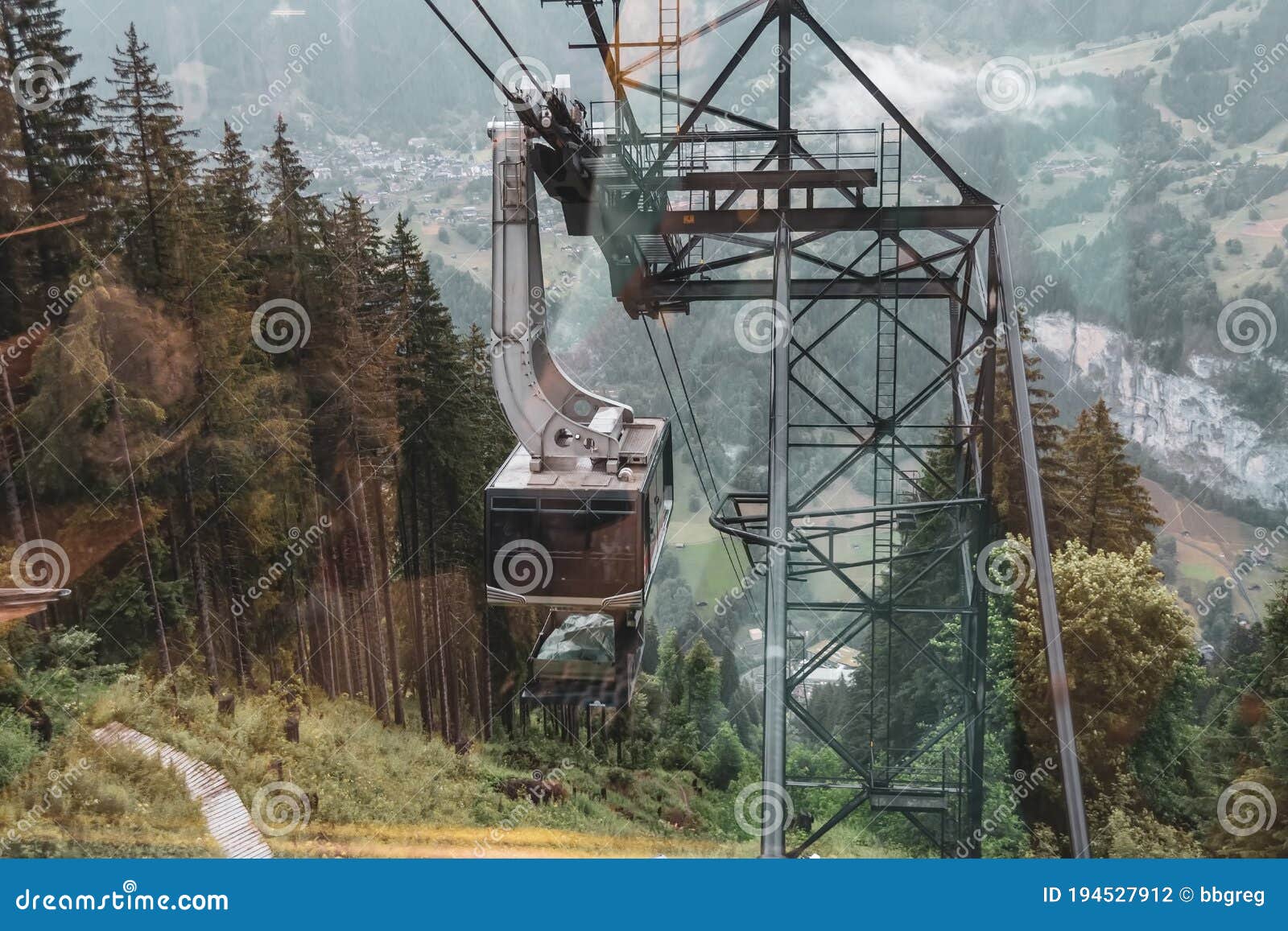 Mountain Trailer Funicular Descends on the Background of Forest and a ...