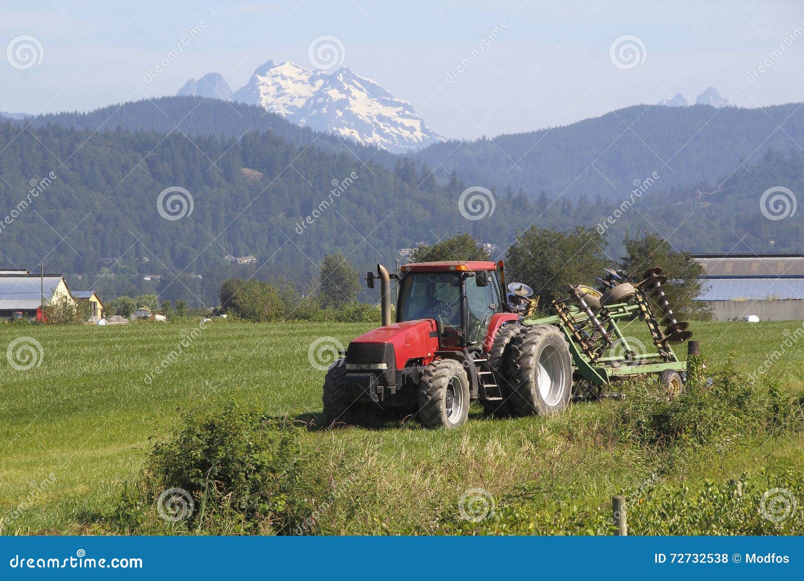 Mountain Valley Farm and Tractor Stock Photo - Image of capped, tractor ...
