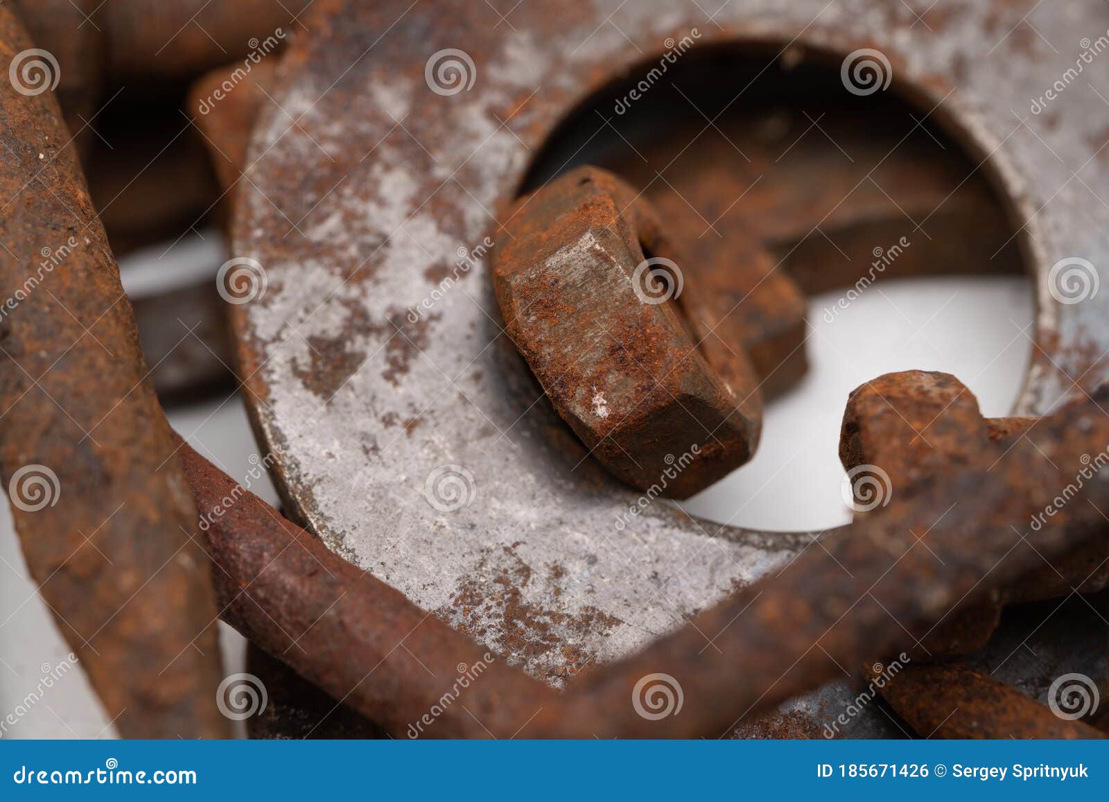 A Mountain of Various Rusty Metal Construction Parts on a White ...