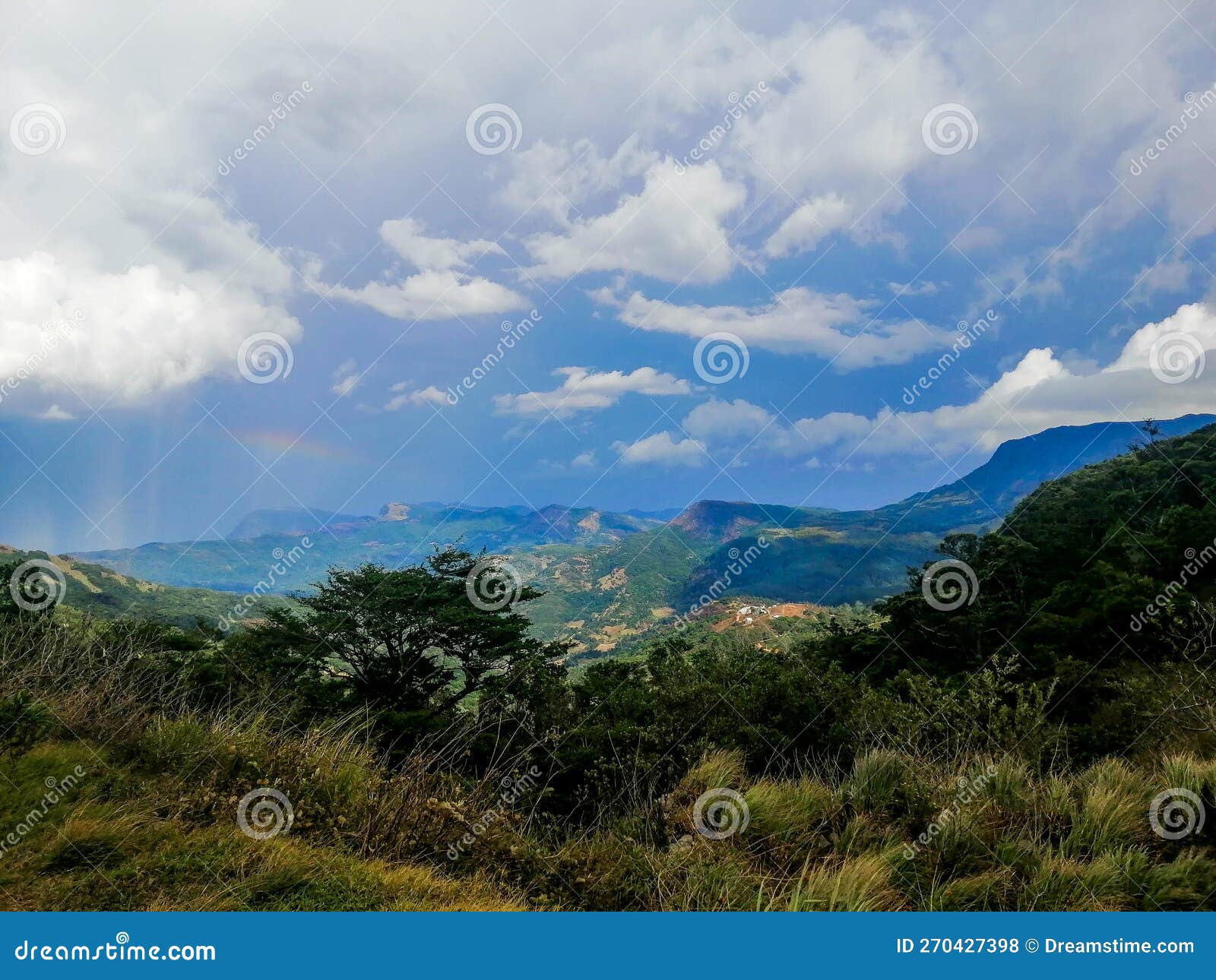 A Mountain View with Rainfall and Rainbow Stock Photo - Image of forest ...