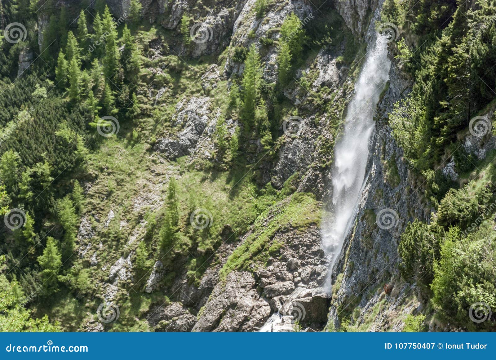 Waterfall Above The Valley With Fog And Rocks Stock Photo ...