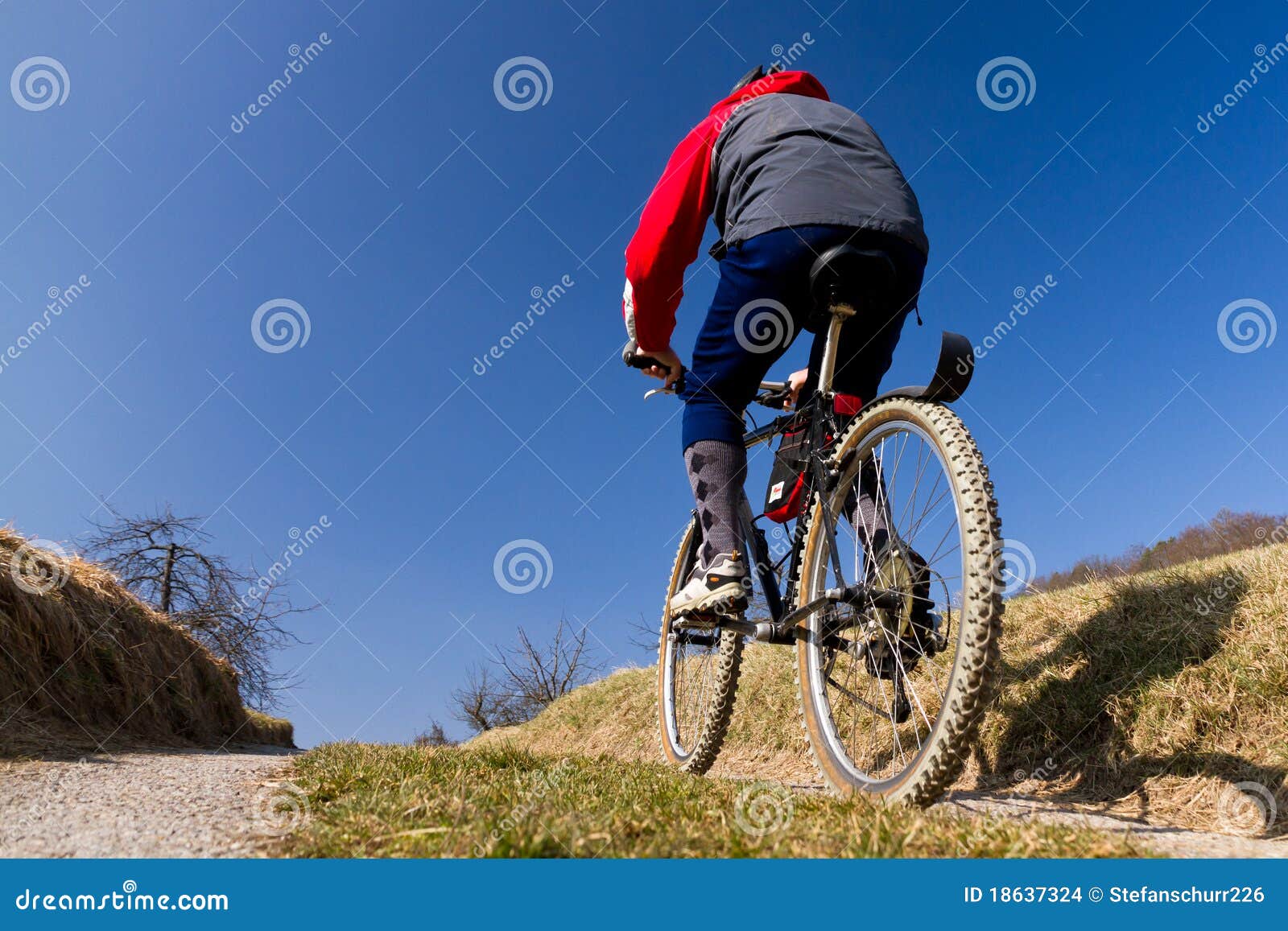 Mountainbiker on a street stock photo. Image of front - 18637324