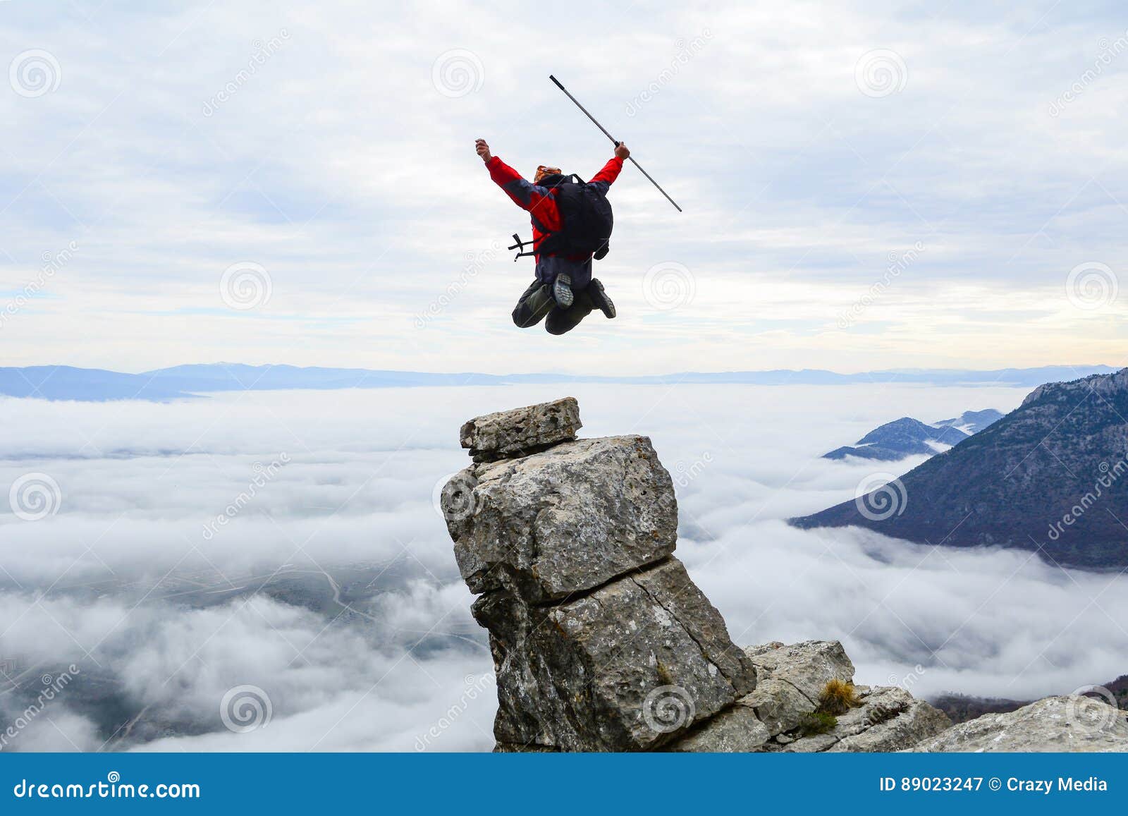 Mountaineer Leaping on Summit Stock Image - Image of cloud, leap: 89023247