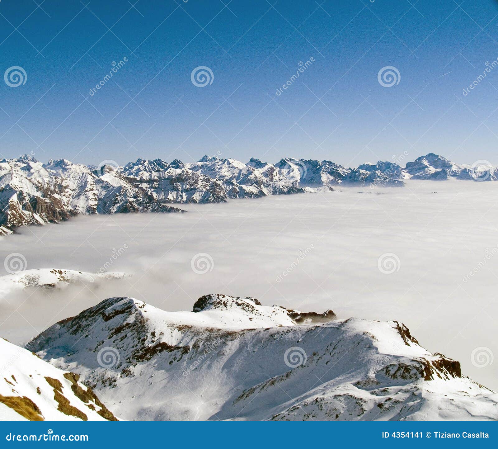 Mountains above clouds stock image. Image of cloudscape - 4354141