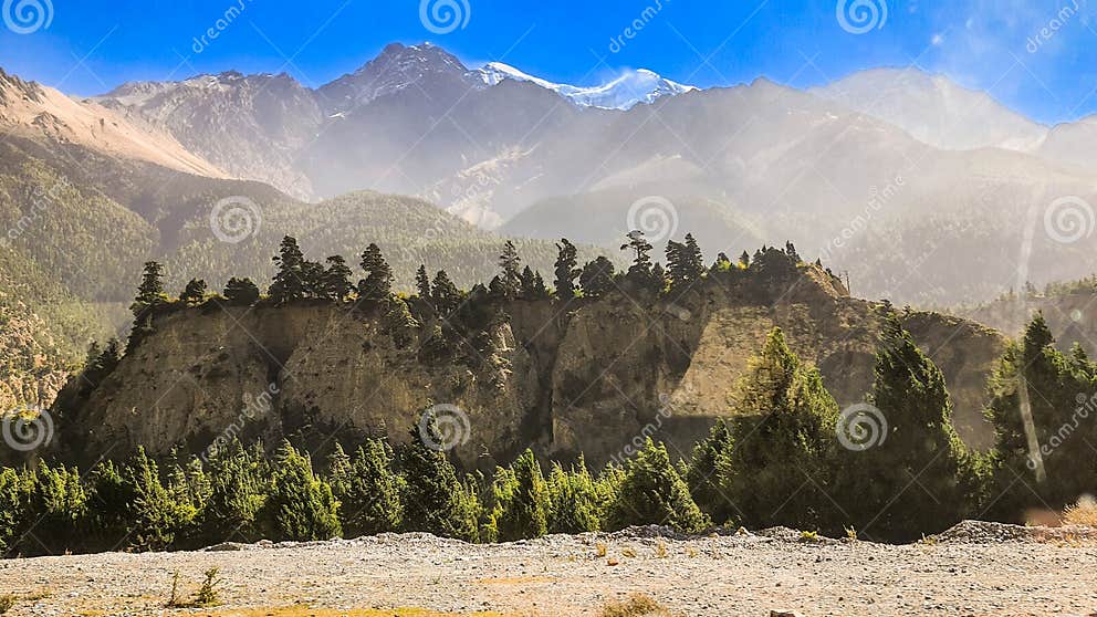 Mountains Behind a Small Cliff with a Forest Stock Image - Image of ...