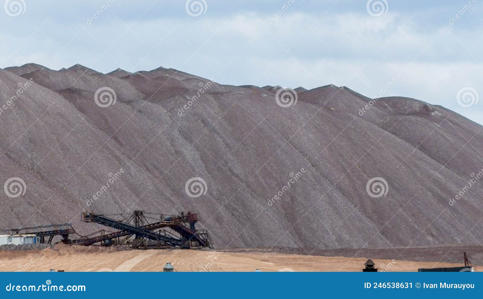 Mountains of Empty Ore when Mining Potassium on Cloudy Sky Background. Transportation of an ...