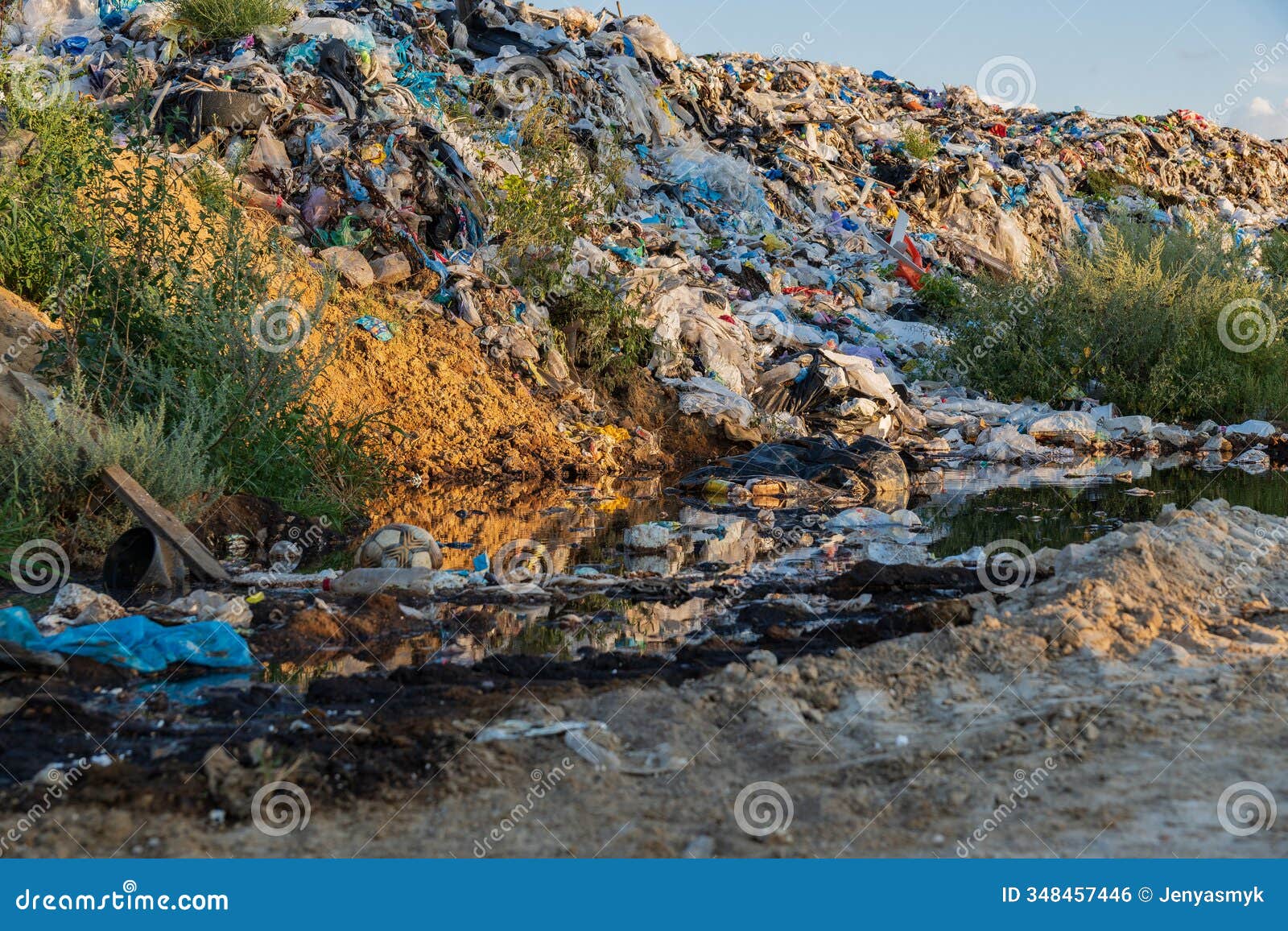 Mountains of Garbage Stretch Across the Landscape, Casting a Shadow on ...