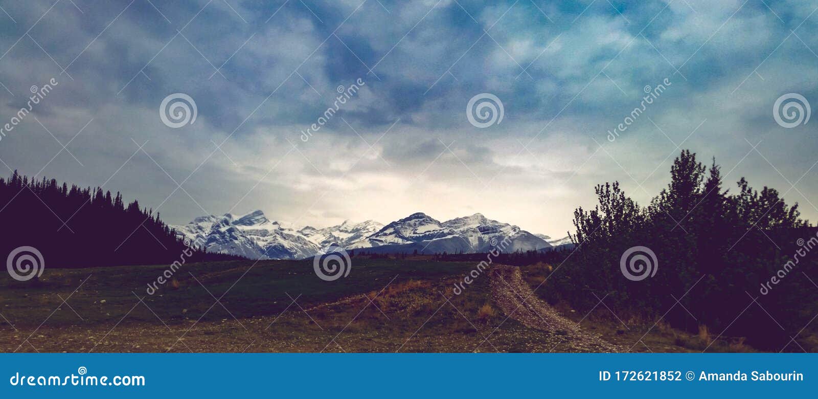 Mountains Peaking Over the Hill Stock Photo - Image of mountains, trees ...