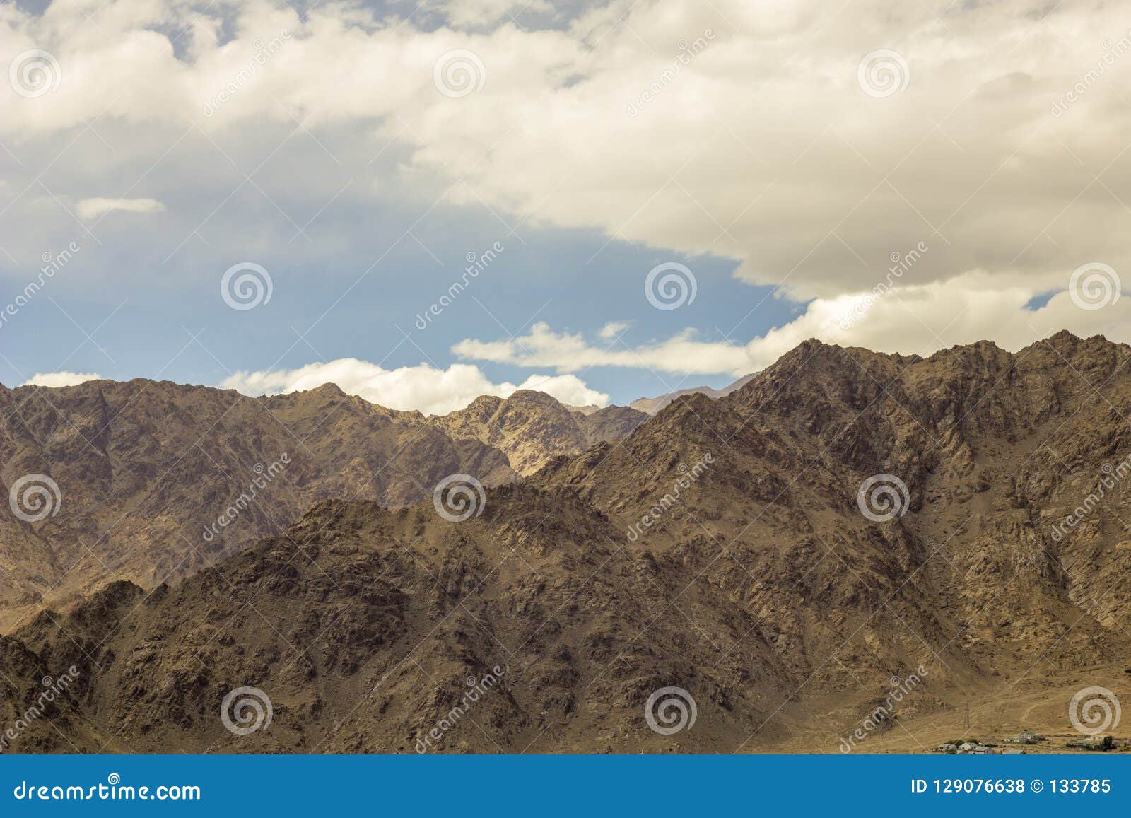 A Mountains without Vegetation Under and Blue Sky Stock Photo - Image ...