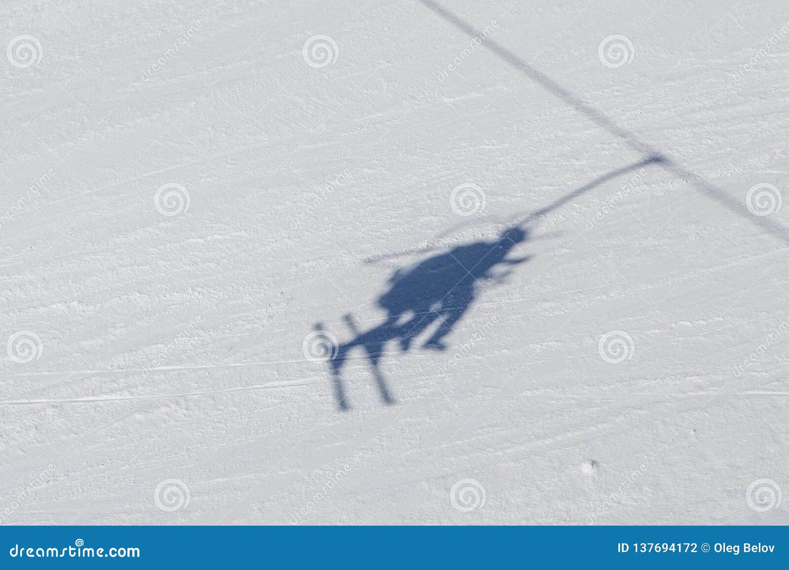 On the Mountainside the Shadows of the Skiers Going Up on Ski-lift are ...