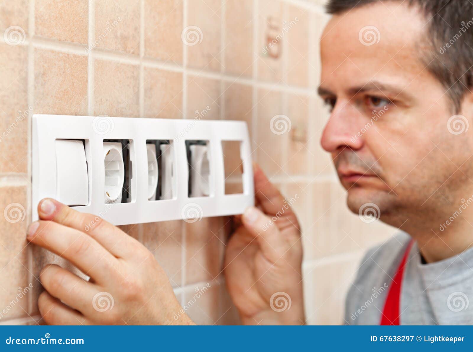 Mounting a Decorative Panel on Electrical Wall Fixture Stock Image ...