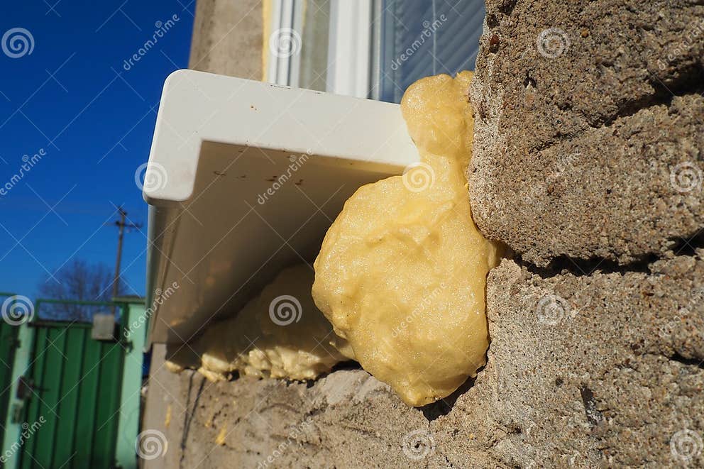 Mounting Foam Under the Window Sill.DIY Concept. Construction PU - Poly ...