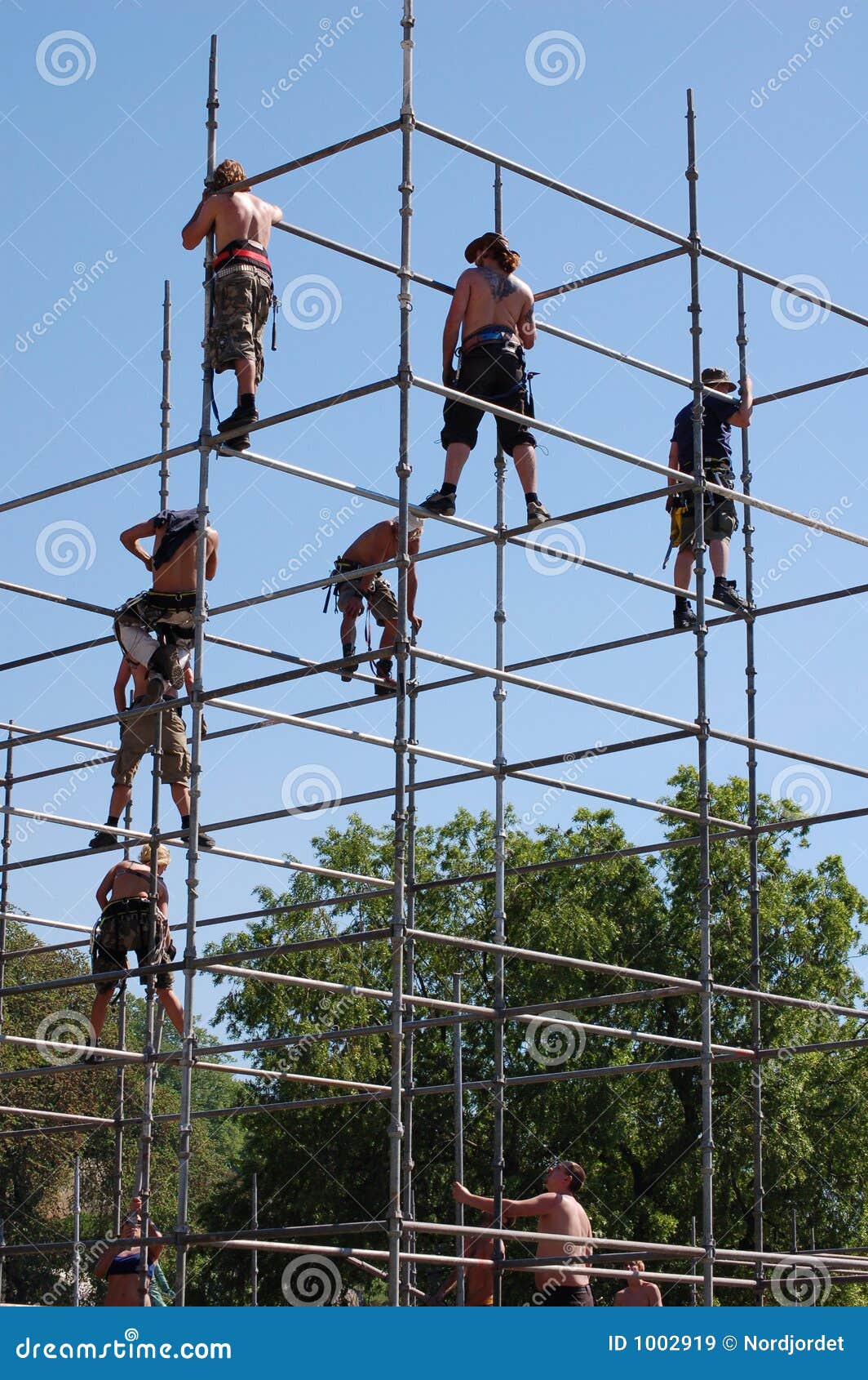 Mounting a scene stock image. Image of band, bodies, activity - 1002919