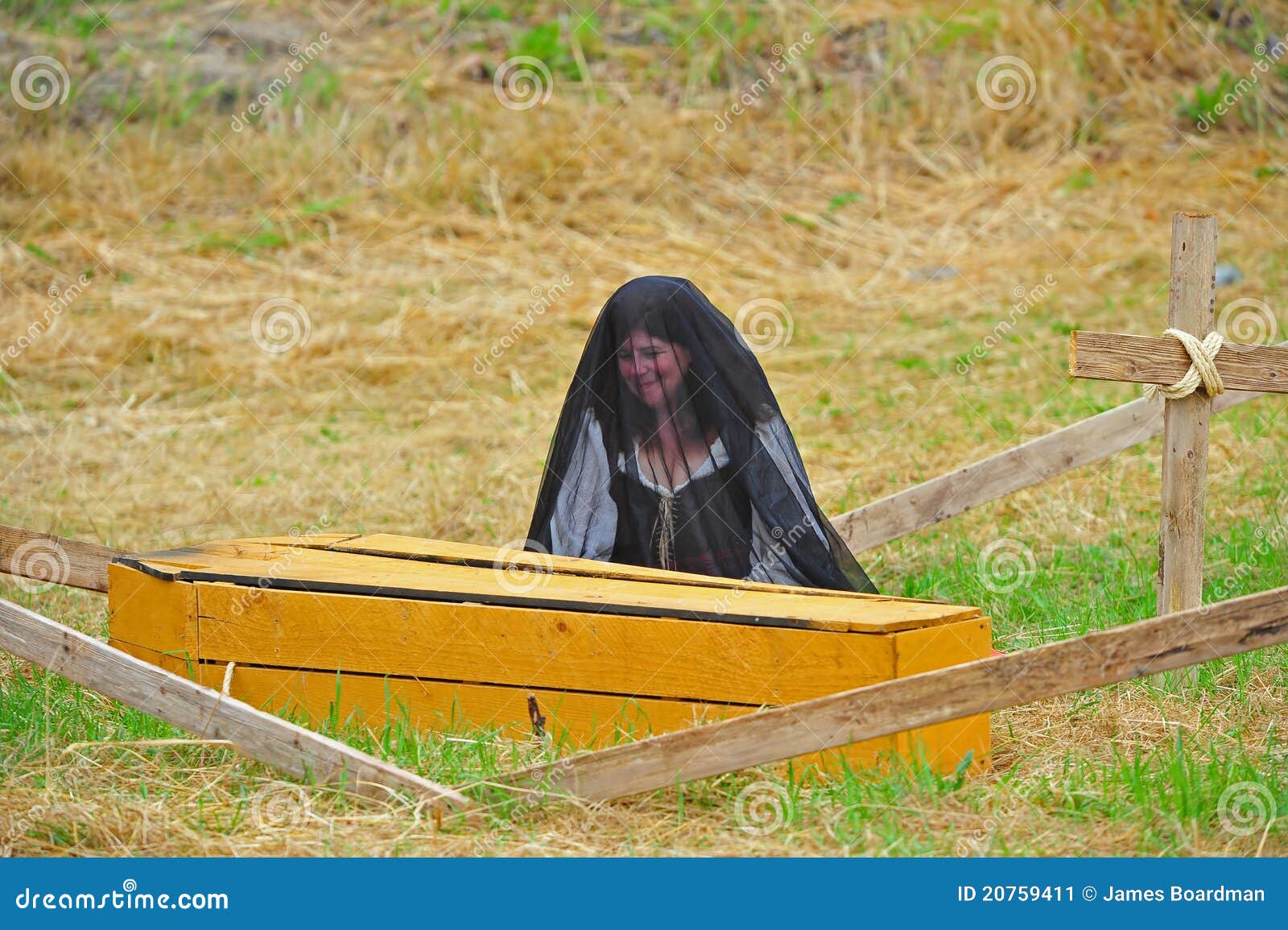 Mourning Widow Next To Coffin Stock Photos - Free & Royalty-Free Stock ...