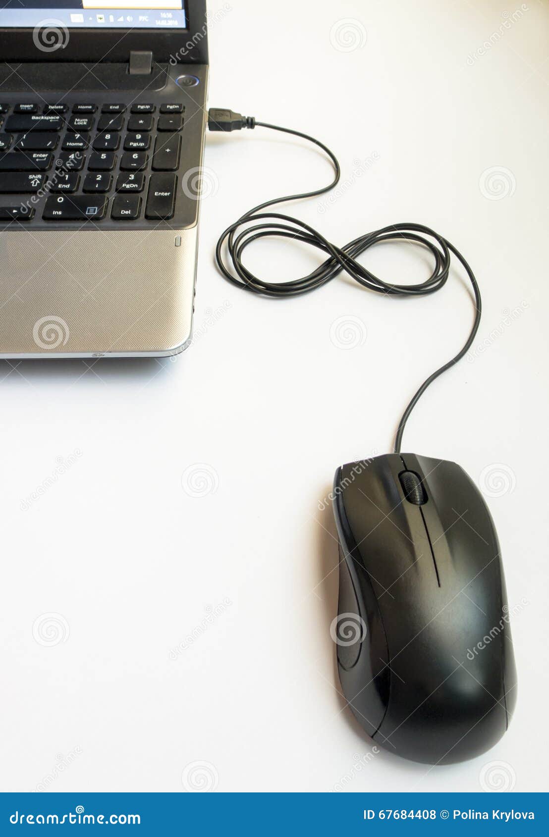 The Mouse Connected To the Laptop Via a Wire in the Shape of an Stock ...