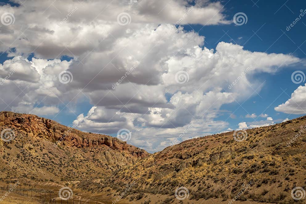 Moutain Desert with White Fluffy Clouds Stock Photo - Image of travel ...