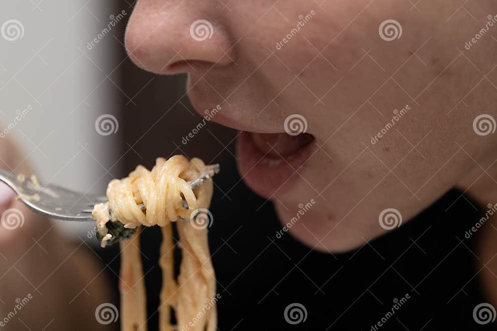 Mouth Eats Spaghetti. Close-up Shot of the Eating Process Stock Photo ...