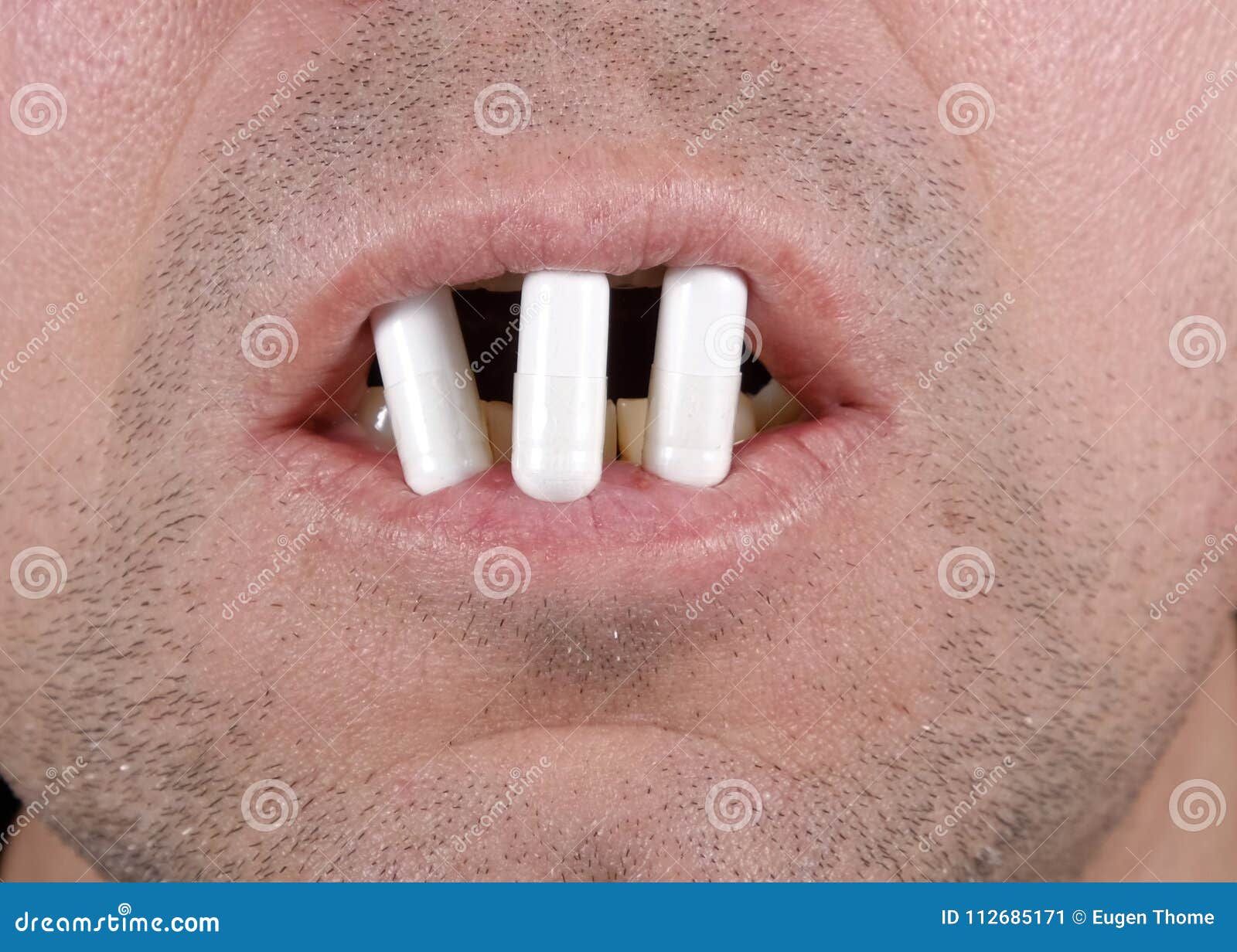 Mouth full of pills stock image. Image of chemistry - 112685171