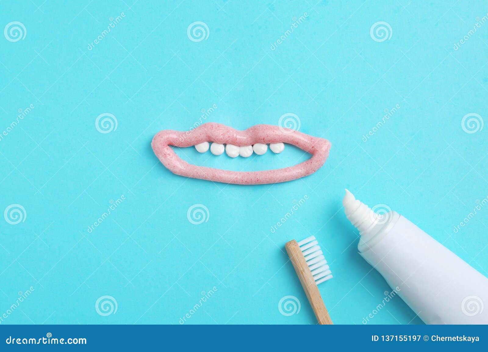 Mouth with Teeth Made of Paste, Tube and Brush on Color Background ...