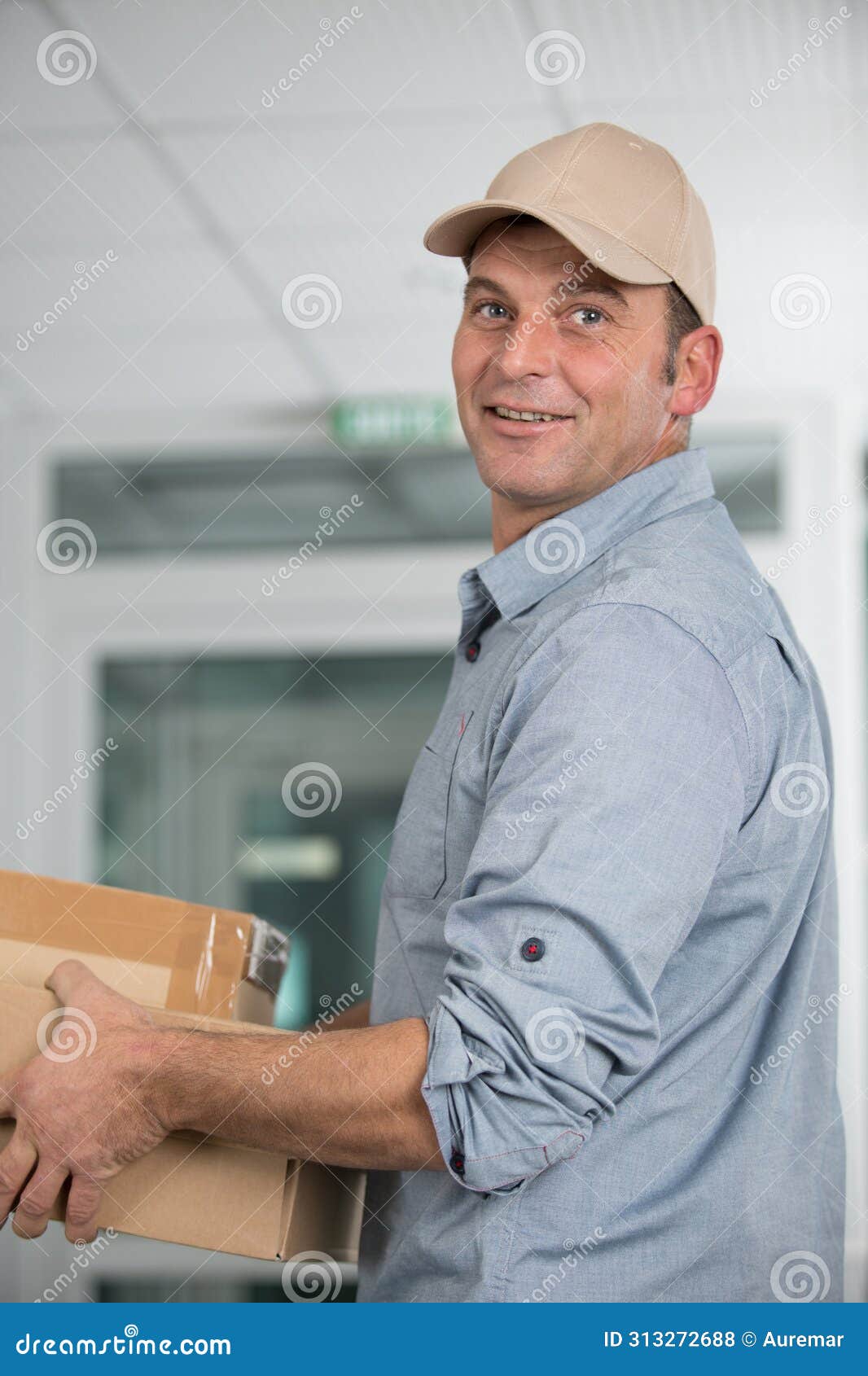 Mover with Cardboard Box at Indoors Apartment Stock Photo - Image of domestic, uniform: 313272688