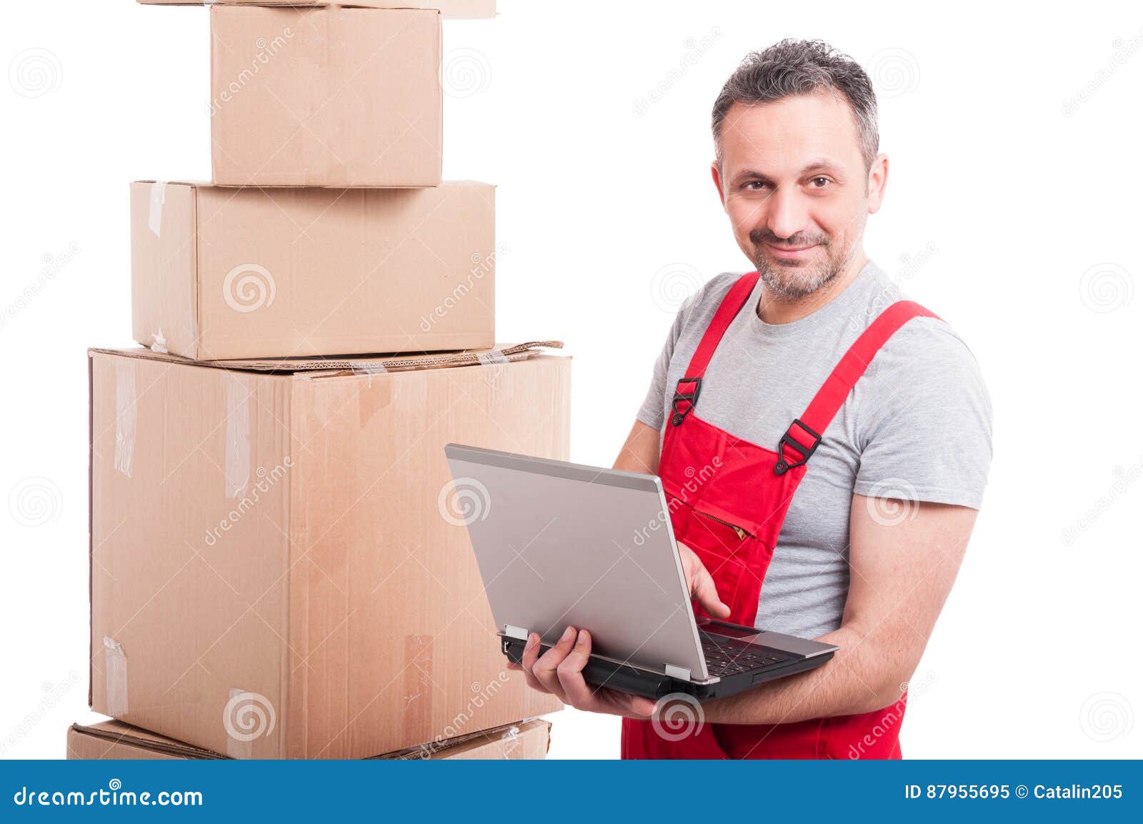 Mover Guy Holding Laptop with Cardboard Boxes Around Stock Image ...