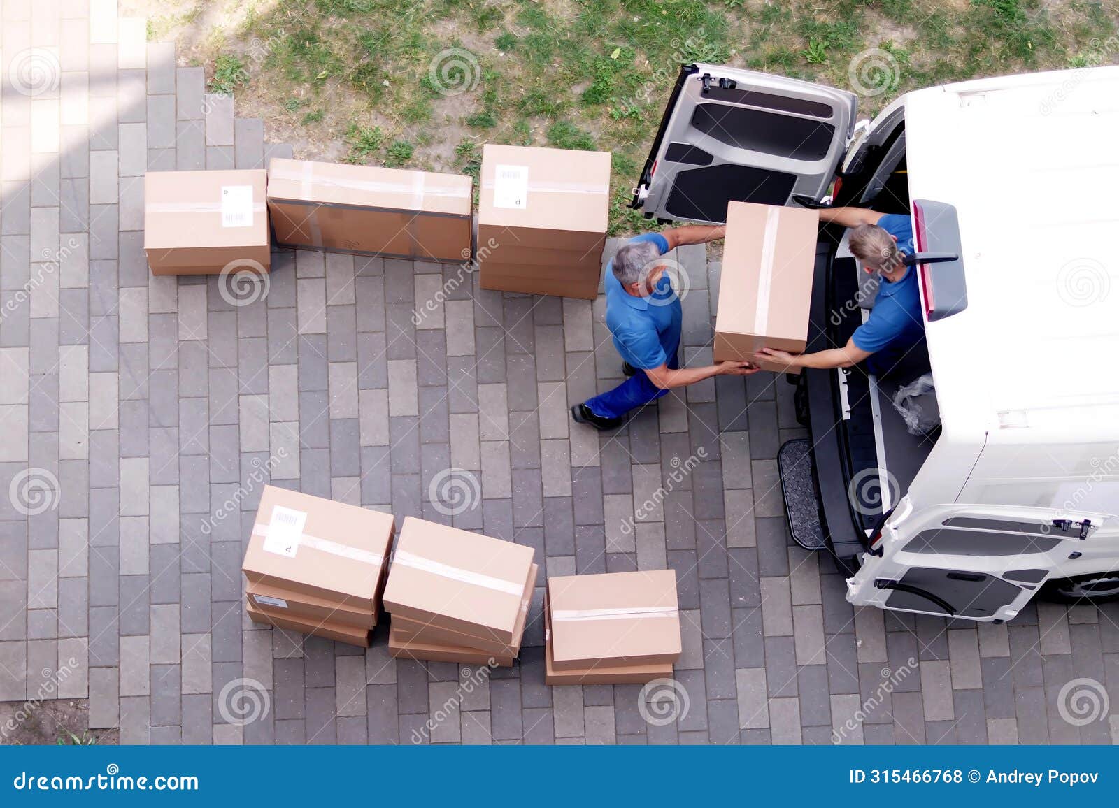 Movers Carrying Heavy Boxes while Moving Stock Photo - Image of service ...