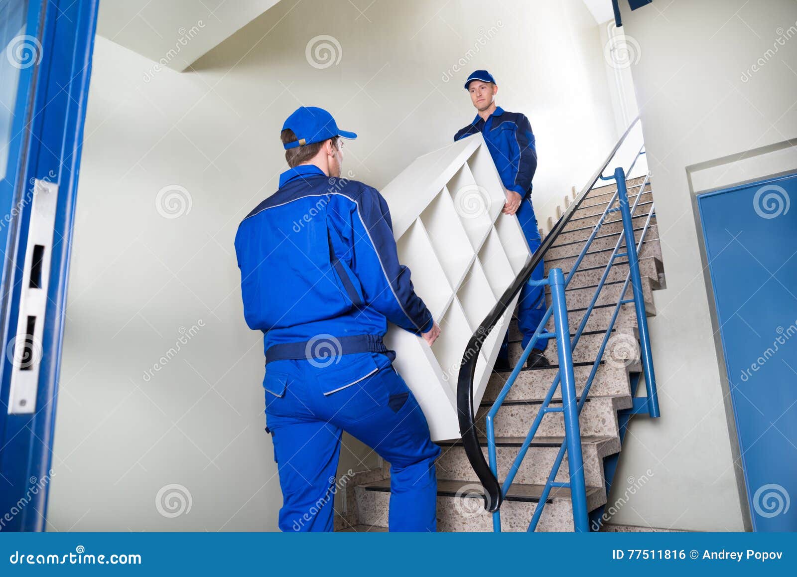 Movers Carrying Shelf while Climbing Steps at Home Stock Photo - Image ...