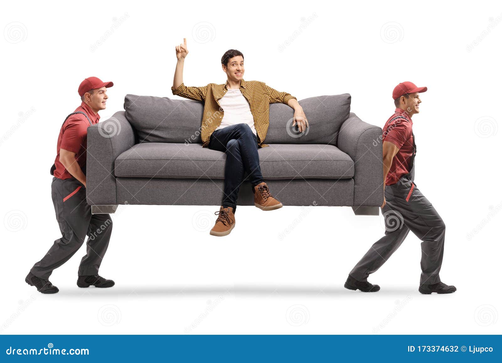 Movers Carrying a Sofa with a Young Man Sitting and Pointing Up Stock ...