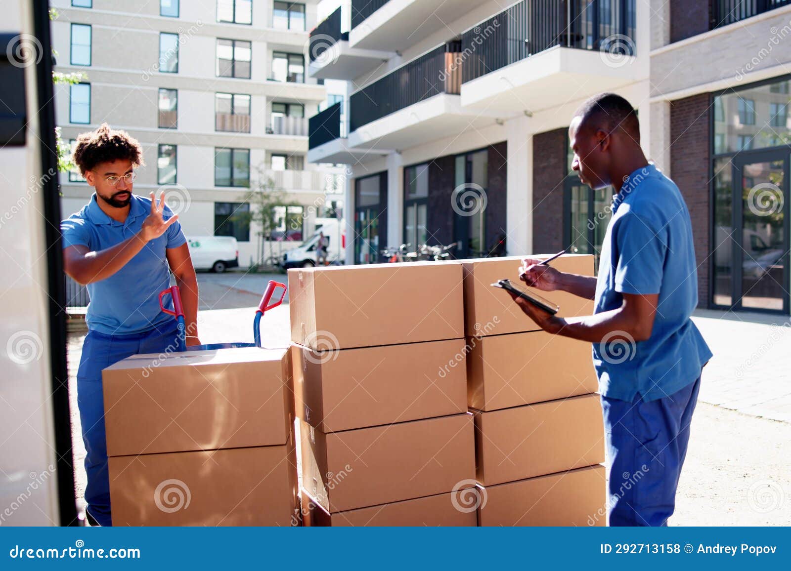Movers Checking Delivery Boxes Stock Photo - Image of move, mover ...
