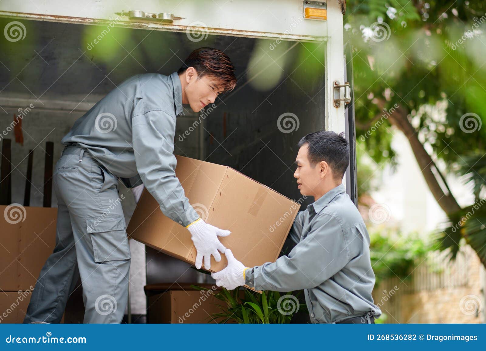 Movers Loading Truck stock photo. Image of belongings - 268536282