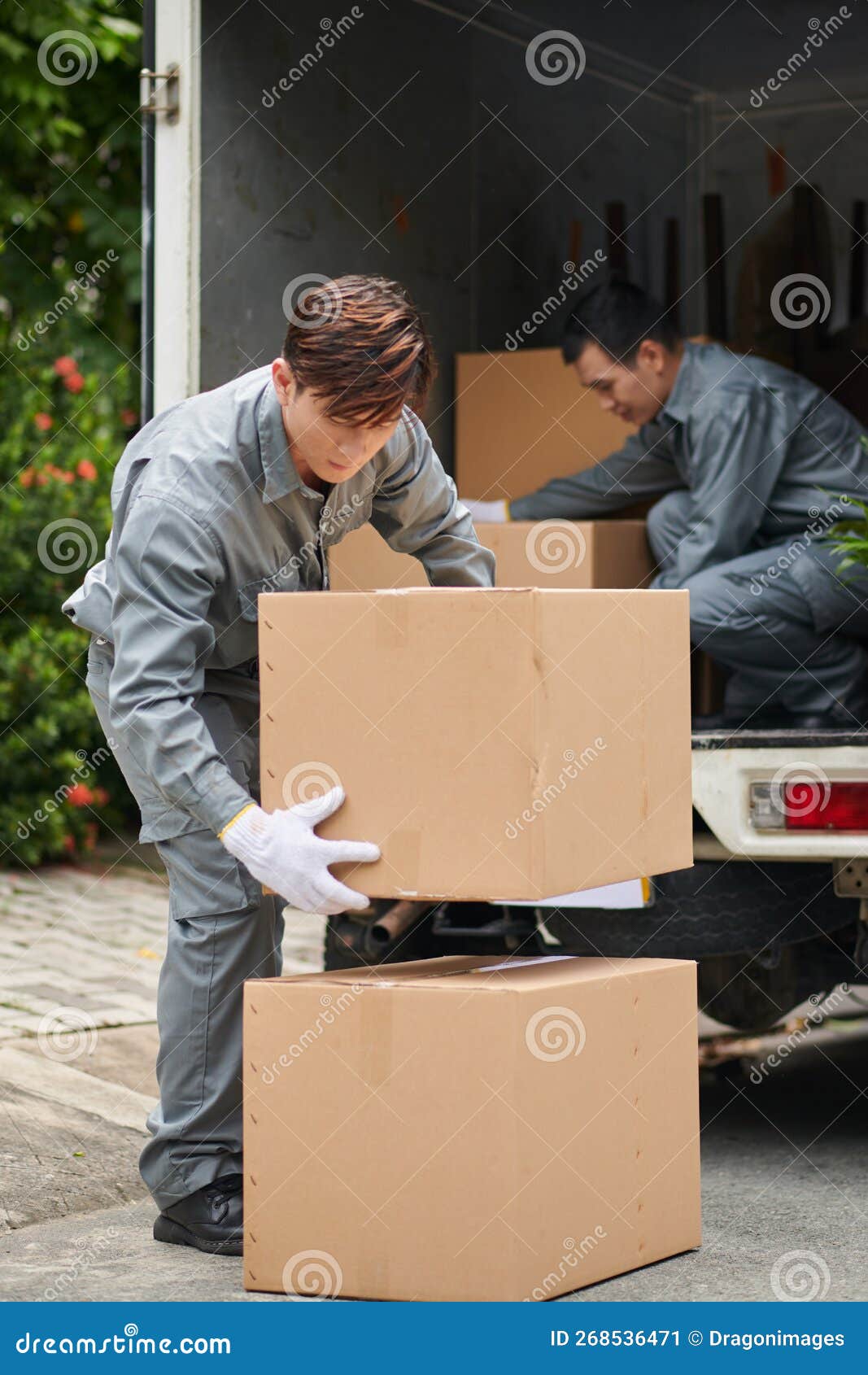 Movers Unloading Van stock image. Image of occupation - 268536471