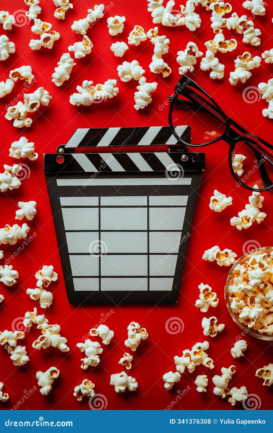 Movie Night Setup with Popcorn and a Clapperboard on a Vibrant Red ...