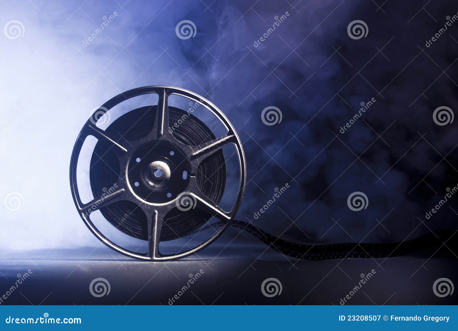Movie spool with film stock image. Image of entertainment - 23208507