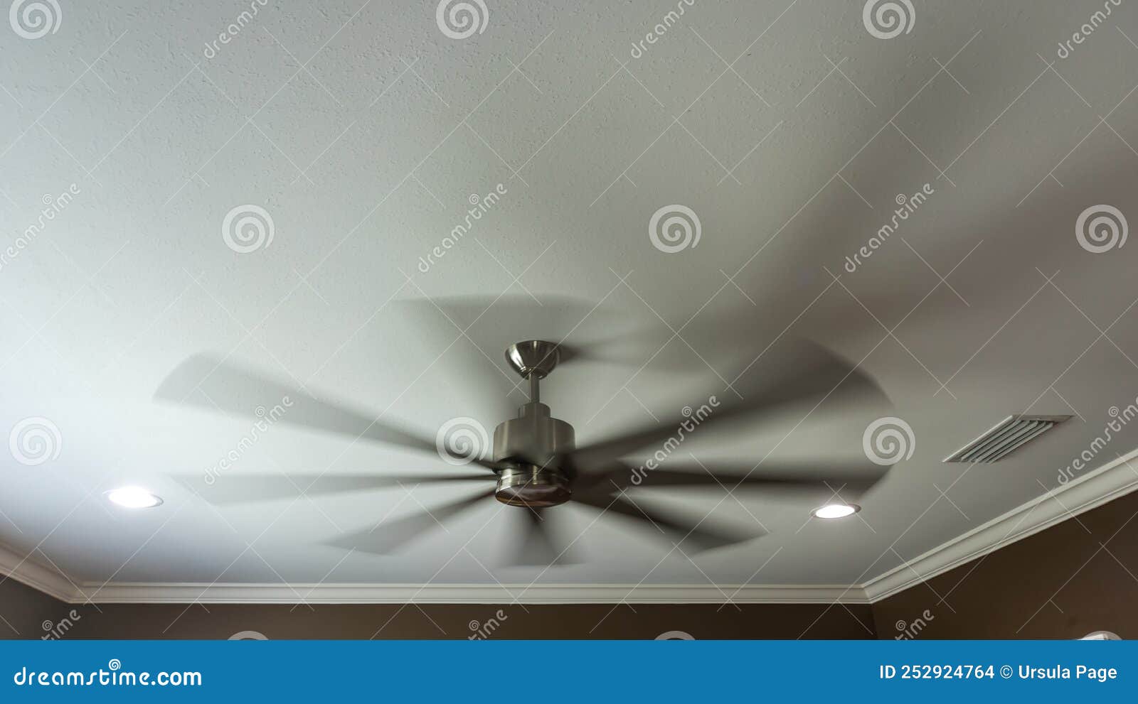 A Moving and Blurred Interior Fan Inside a New Construction House with ...