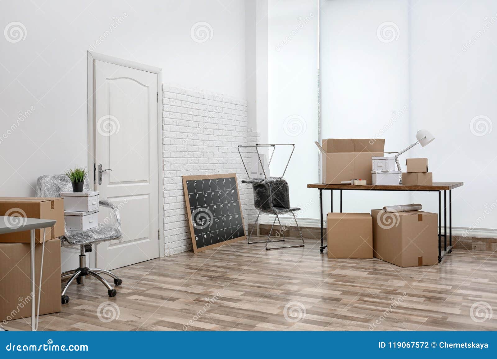 Moving boxes and furniture stock photo. Image of pile - 119067572