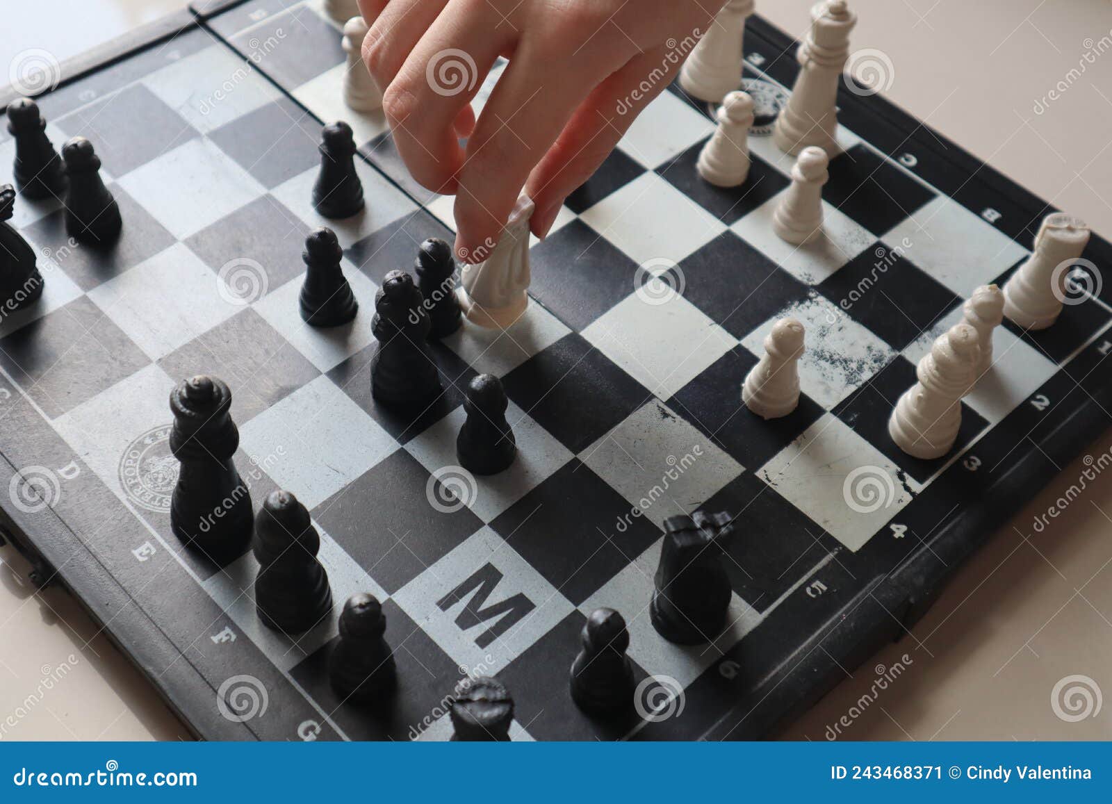Moving a Chess Piece while Playing a Chess Game at Home Stock Image ...