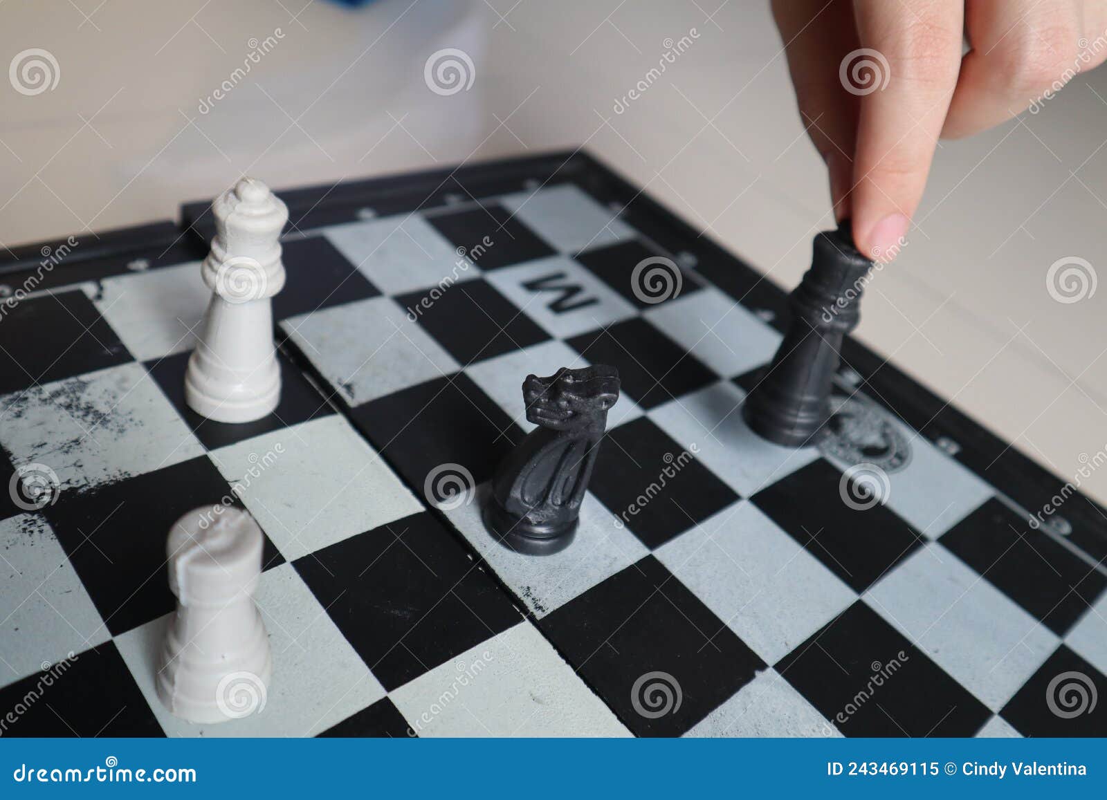 Moving a Chess Piece while Playing a Chess Game at Home Stock Image ...