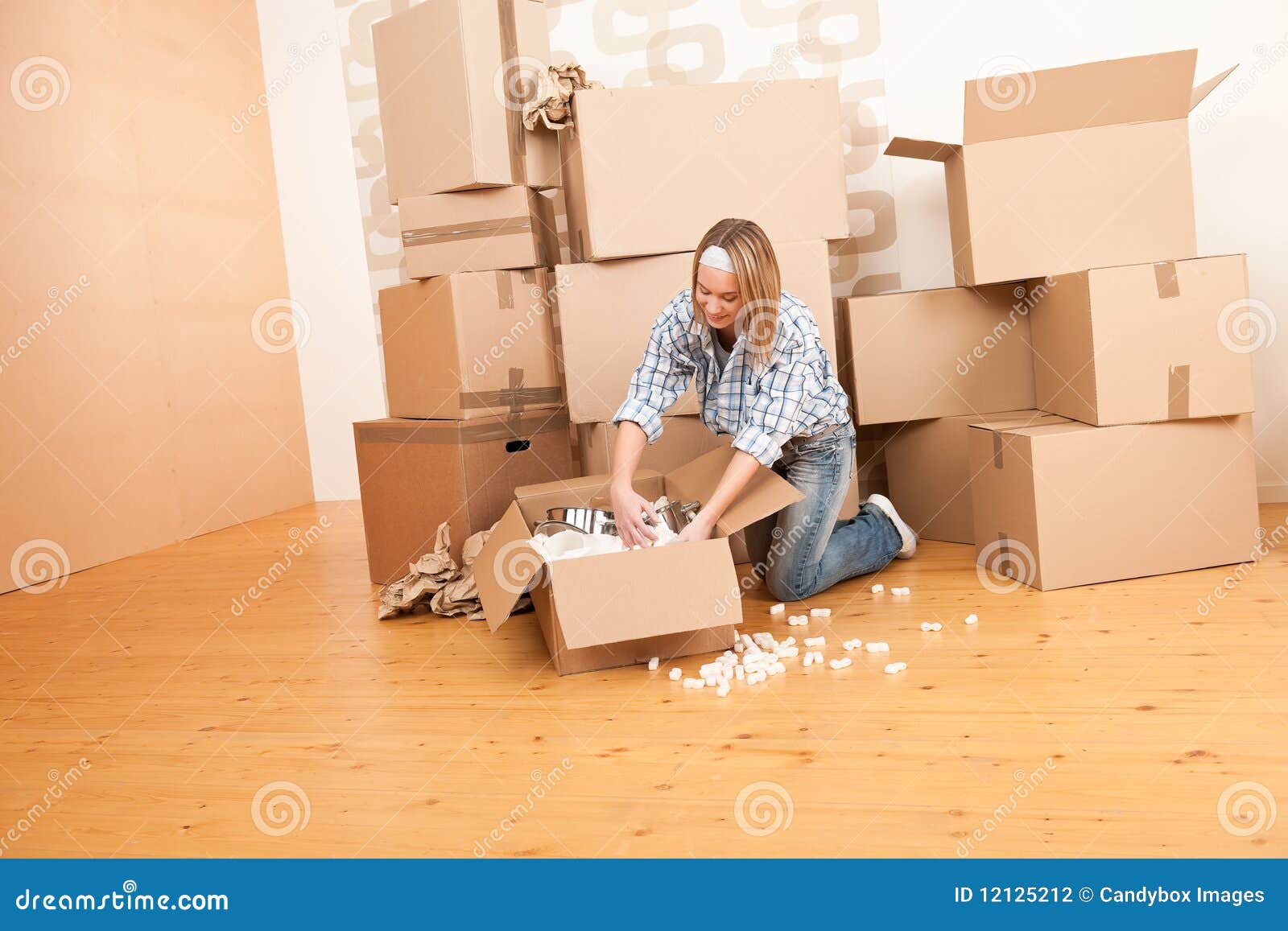 Moving House: Happy Woman Unpacking Box Stock Photo - Image of indoors ...