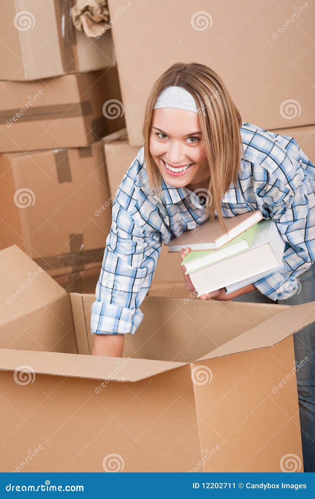 Moving House: Woman Unpacking Box with Book Stock Image - Image of ...