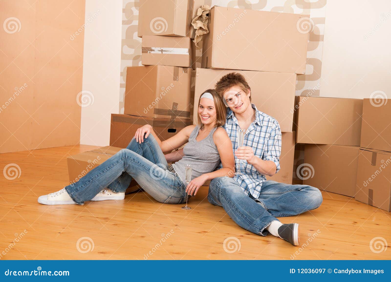 Moving House: Young Couple Celebrating Stock Image - Image of cardboard ...