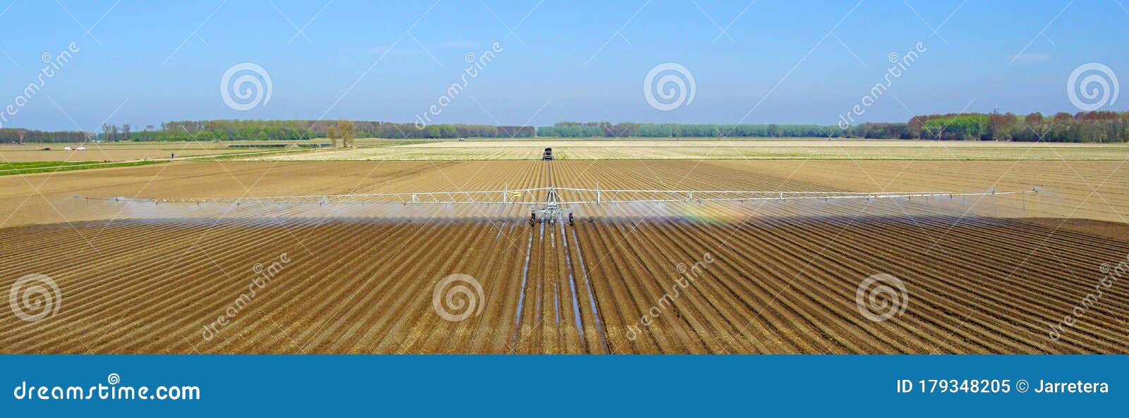 Moving Irrigation Sprinkler System. Stock Image - Image of europe ...
