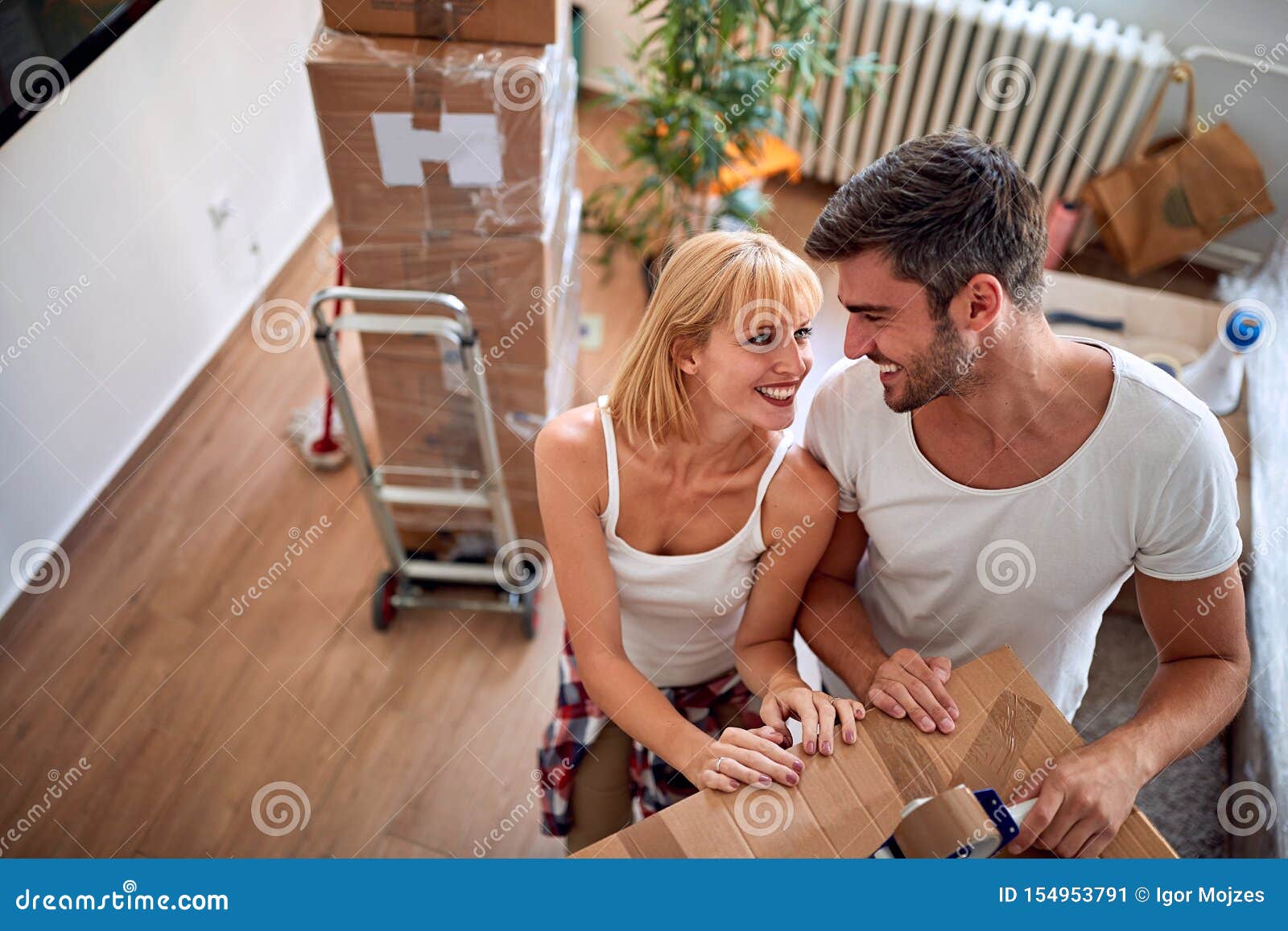 Moving in New House. Couple Packing Box Stock Image - Image of father ...