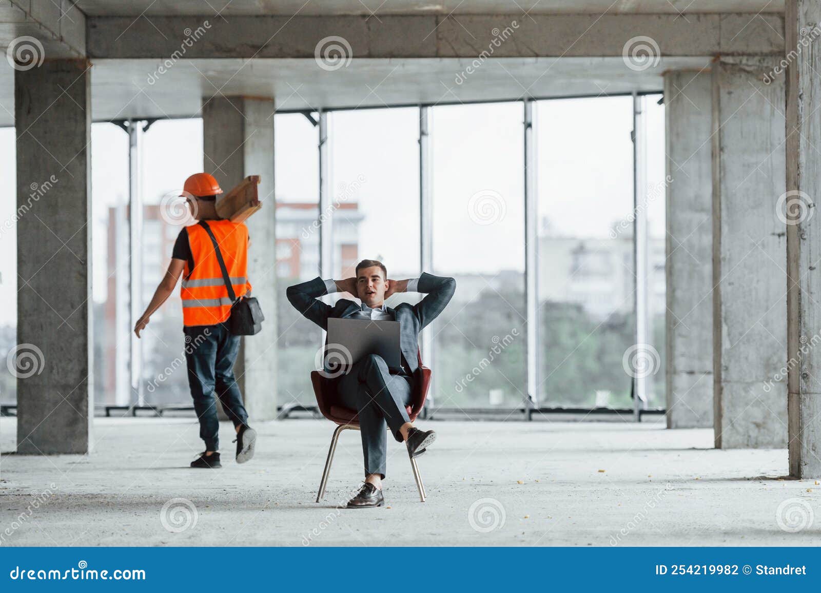 Moving Object. Man in Suit and Handyman in Orange Protective Wear is ...