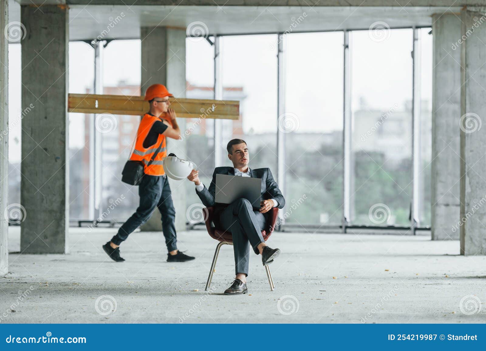 Moving Object. Man in Suit and Handyman in Orange Protective Wear is ...