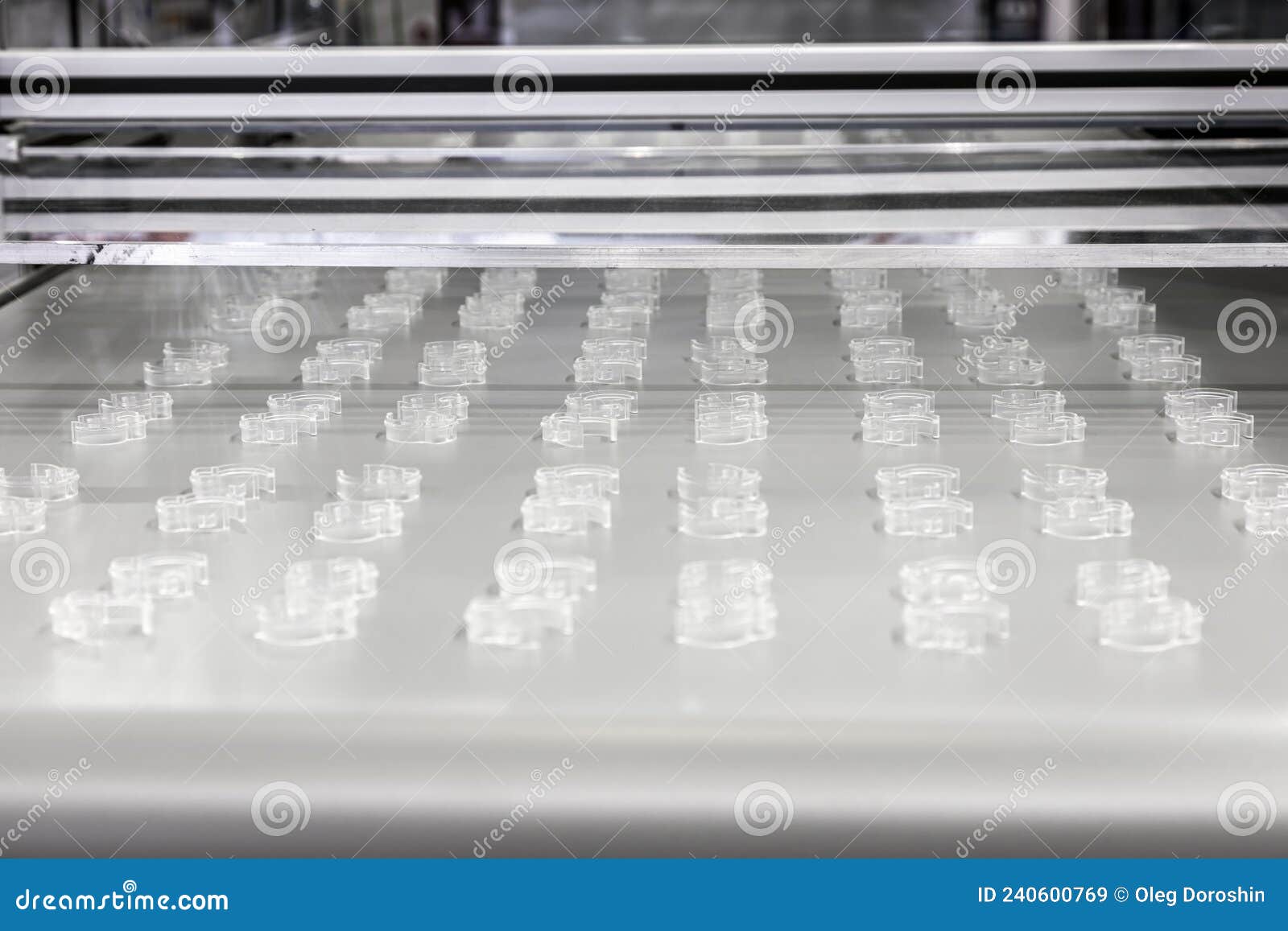 Moving Parts of the Conveyor with Plastic Products Stock Image - Image ...