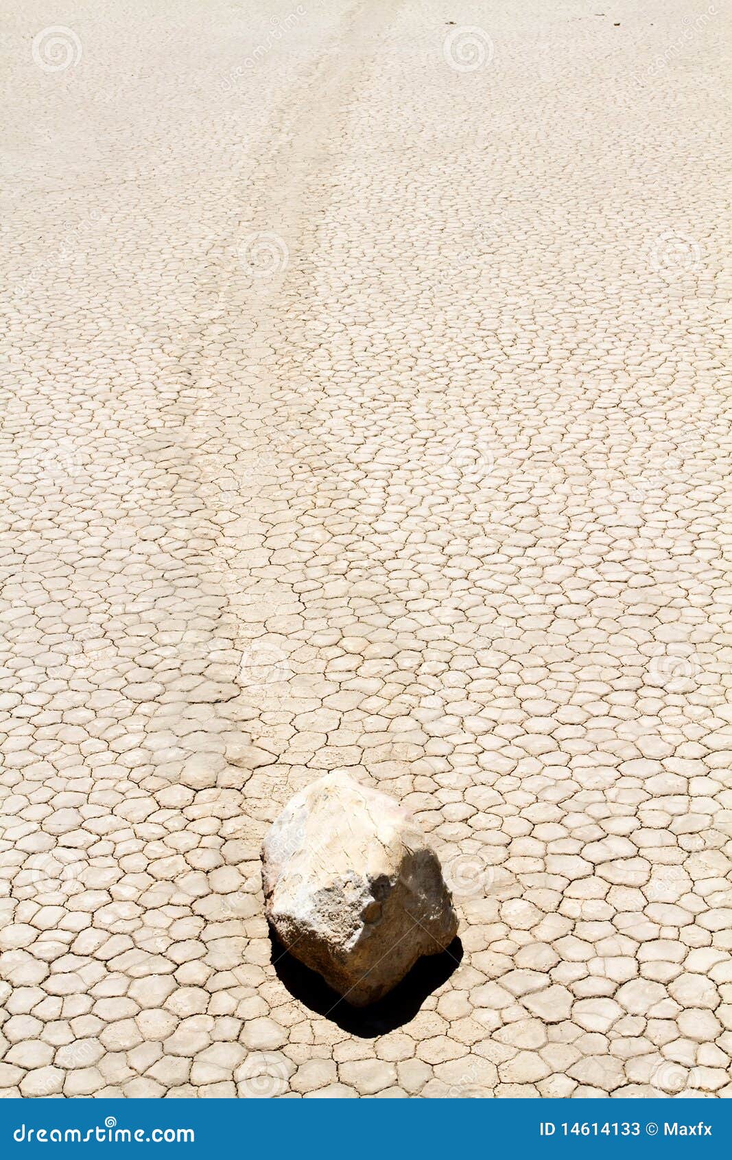 Moving Rock On Cracked Desert Ground Stock Image - Image: 14614133
