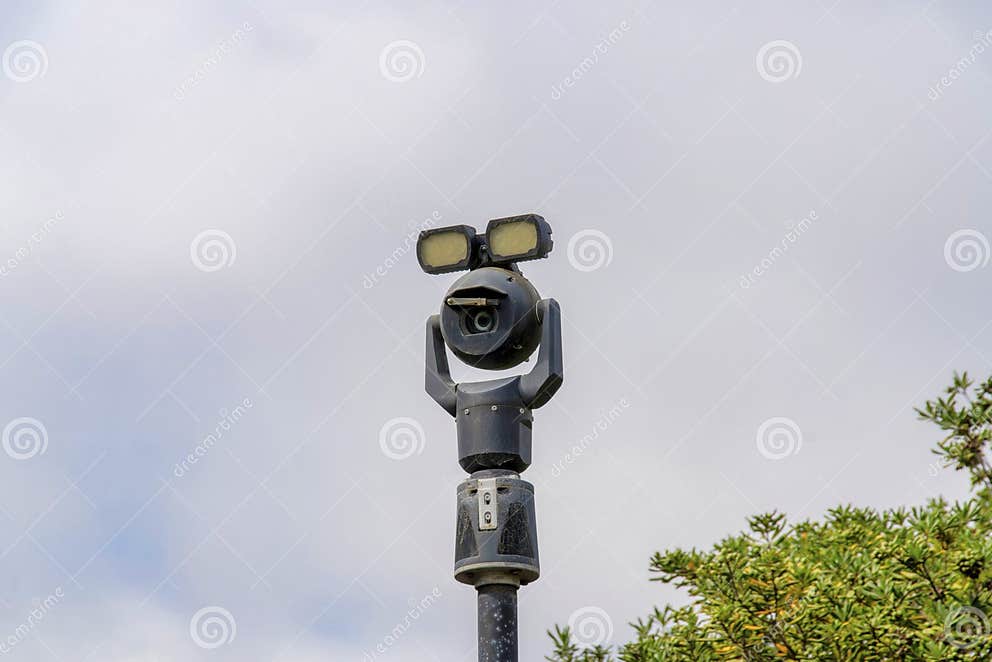 Moving Security Camera on a Post with Lights on Top Stock Photo - Image ...