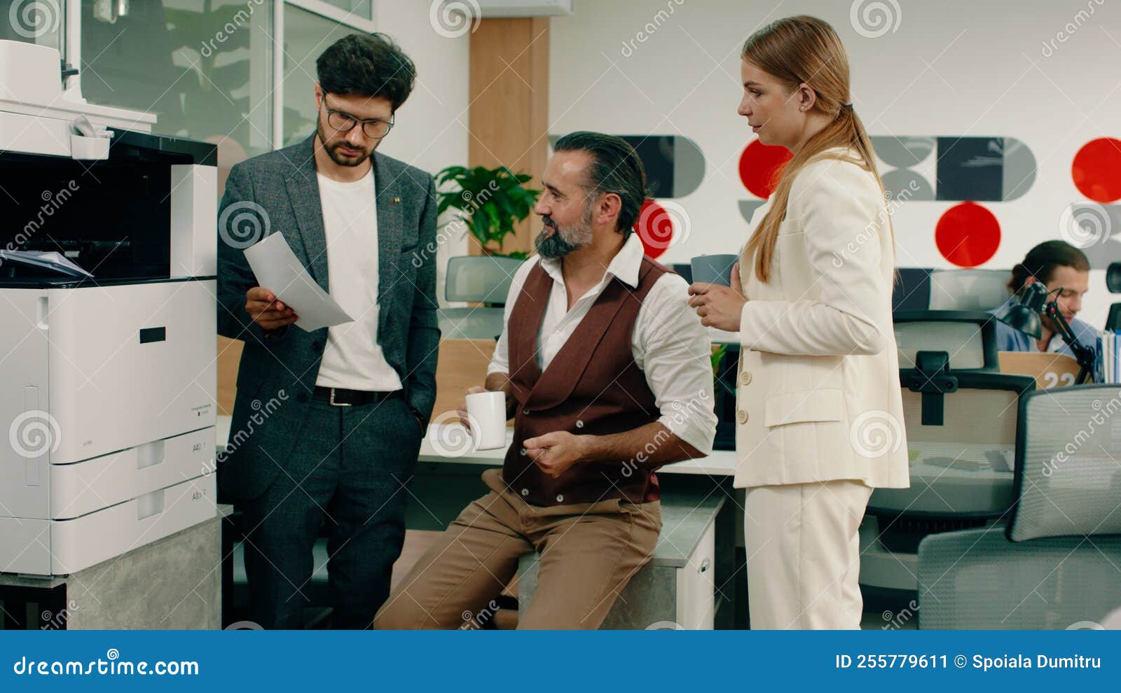 A Moving Shot of Three Colleagues in an Office are Looking at Their ...