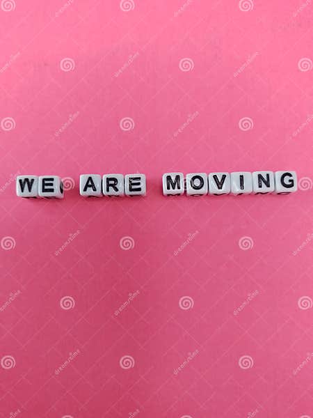 We are Moving Sign on a Pink Background Stock Image - Image of font ...