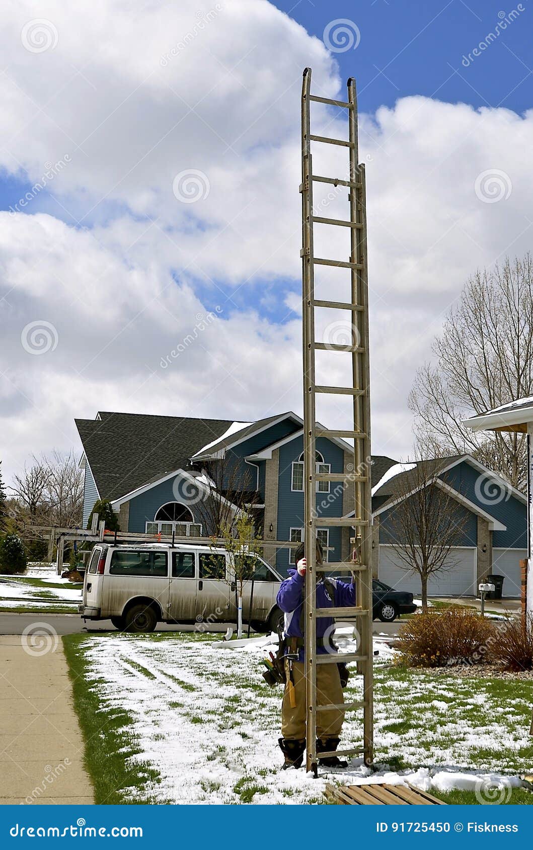 Moving a Tall Ladder at a Construction Site Stock Photo - Image of ...